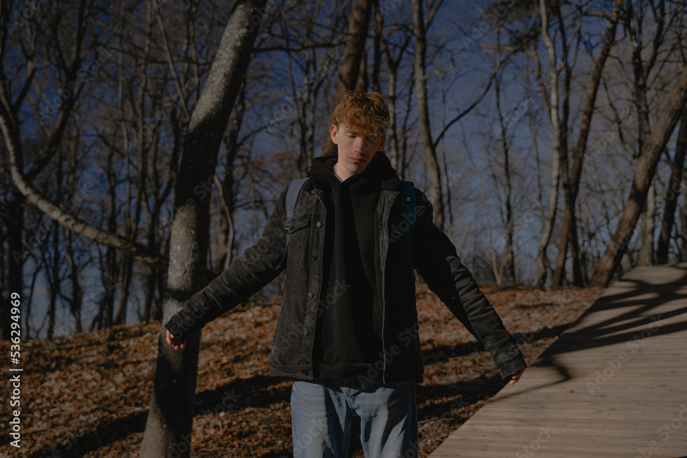 A Young Guy In The Middle Of A Sleeping Forest With His Eyes Closed, A ...