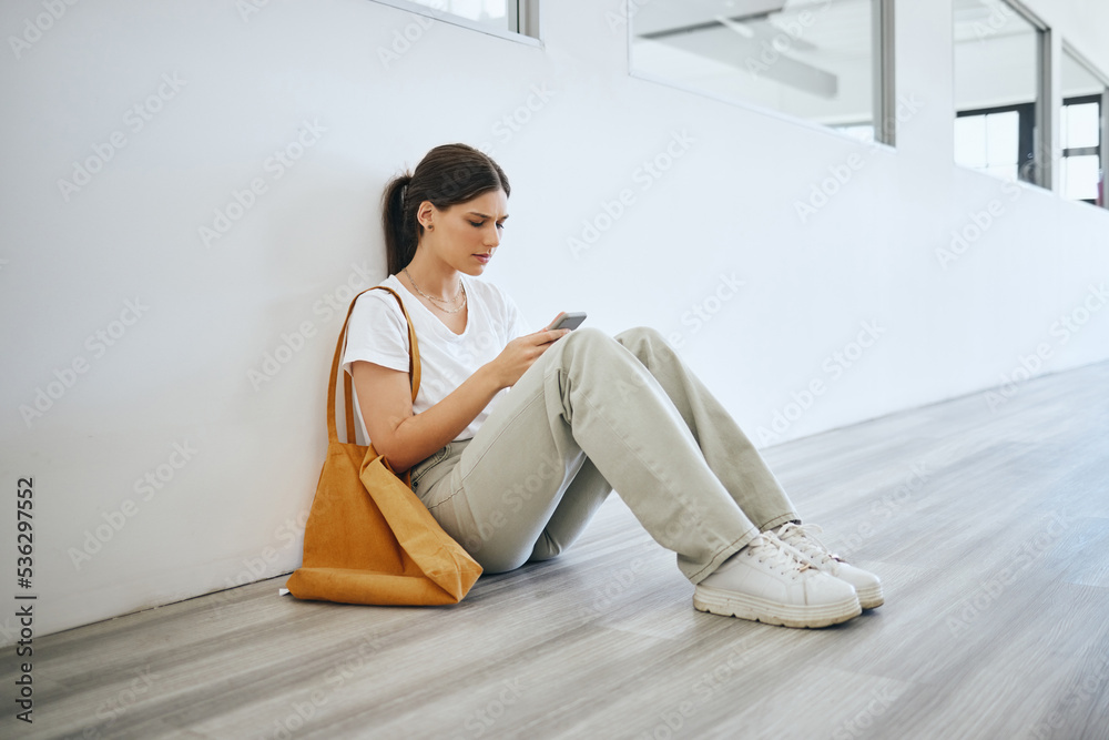 Sad university woman, student alone on the floor in the hallway after ...
