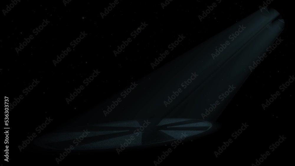 A large fan on the ceiling cast shadows on the floor of a dark room ...