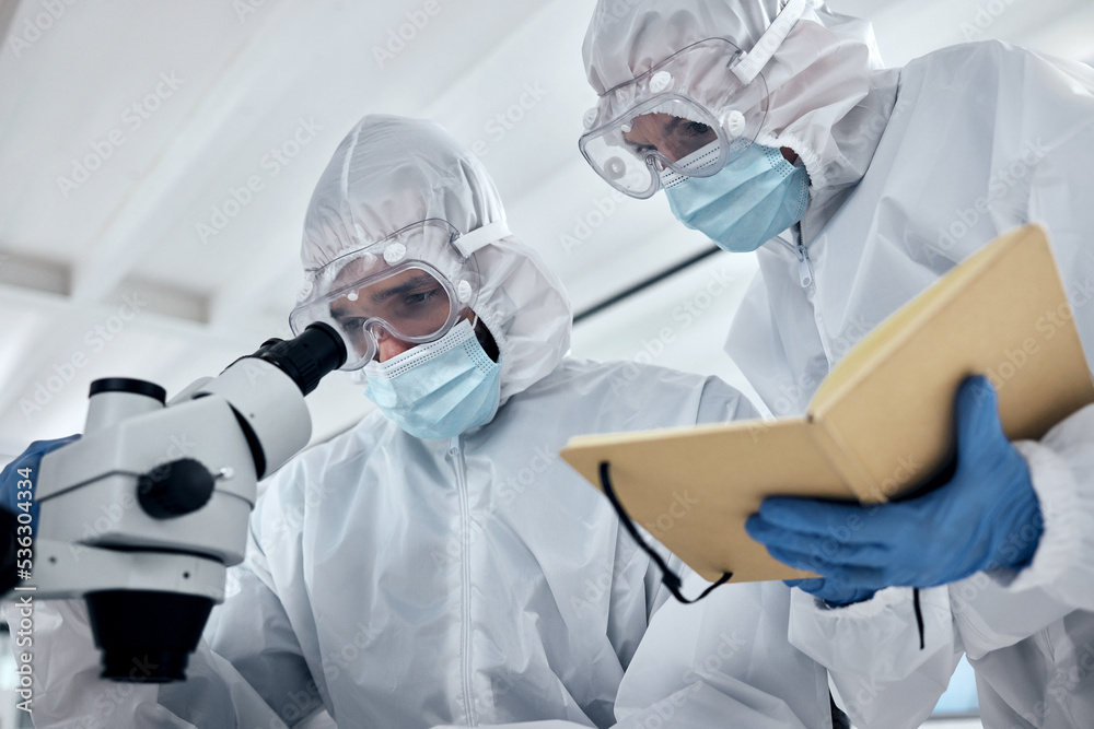 Scientists hazmat suit, microscope and laboratory research planning ...