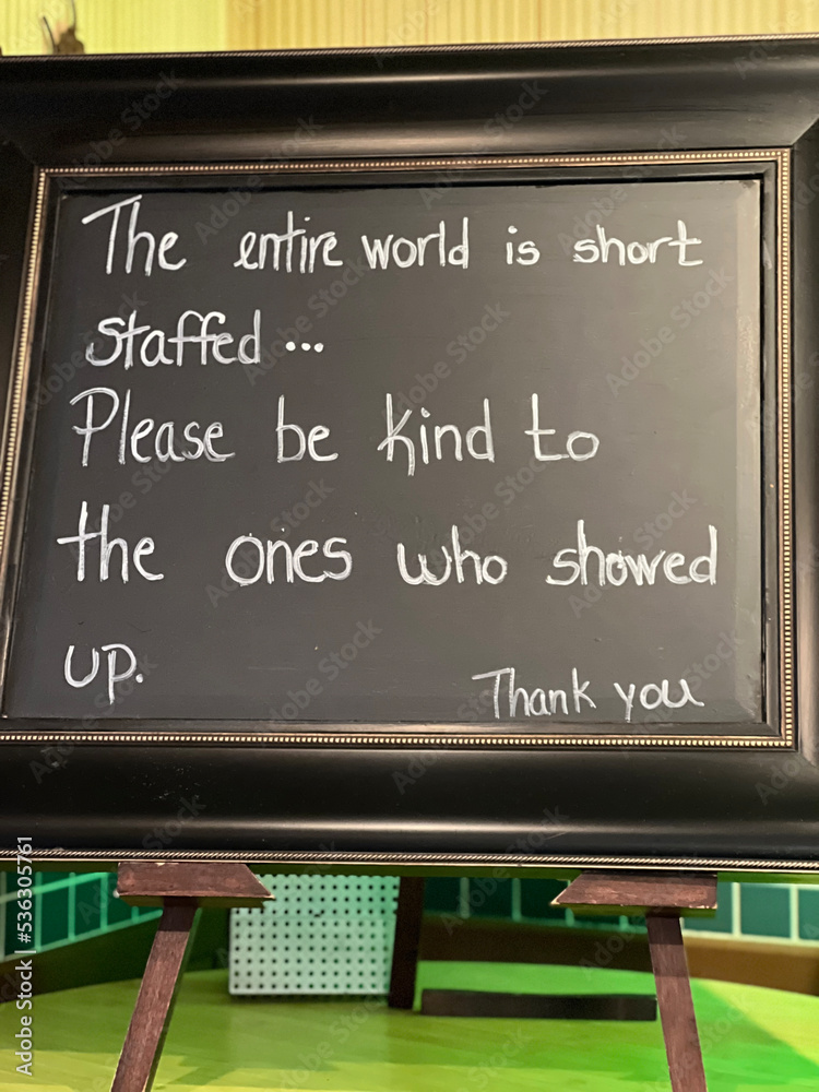 Sign posted in a restaurant as a reminder to be kind to staff during ...