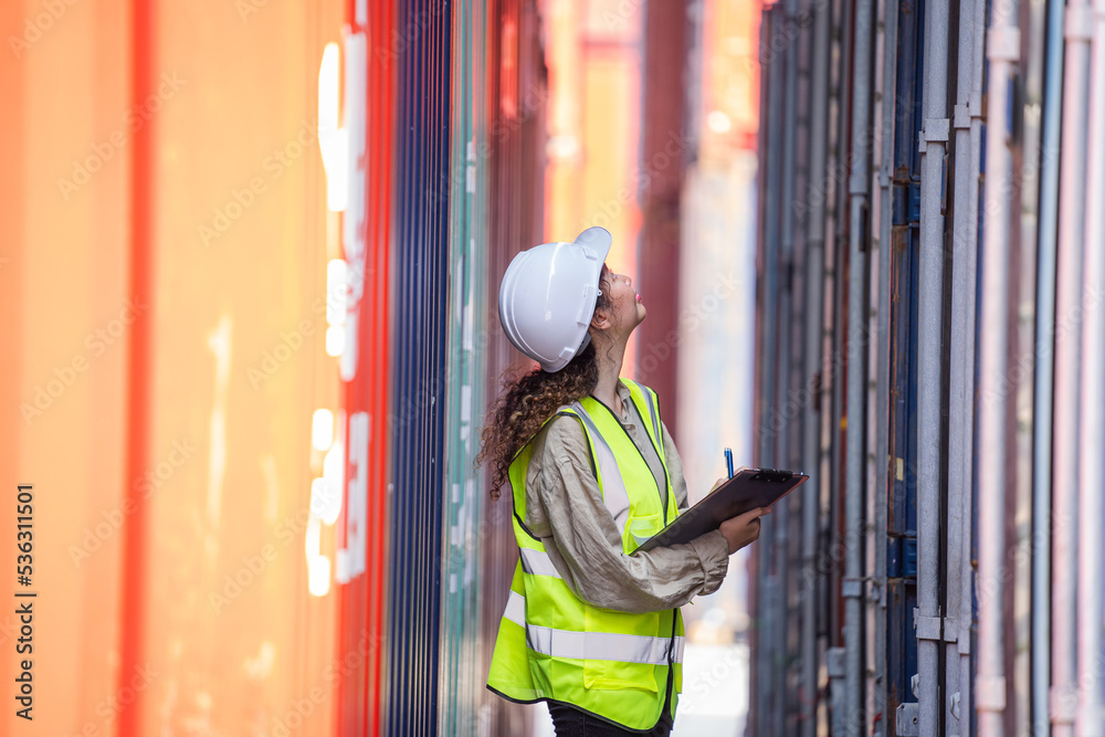 Inspector checking container yard Organising stock to pack into ...