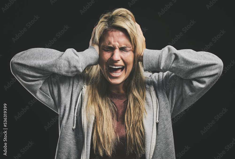 Anxiety, bipolar woman crying, frustrated or crazy on a dark studio for ...