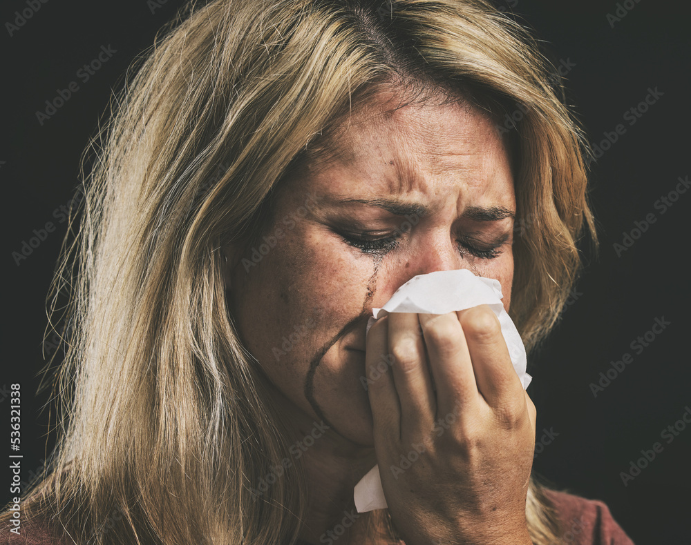 Woman sad and crying with depression, anxiety and stress against a ...