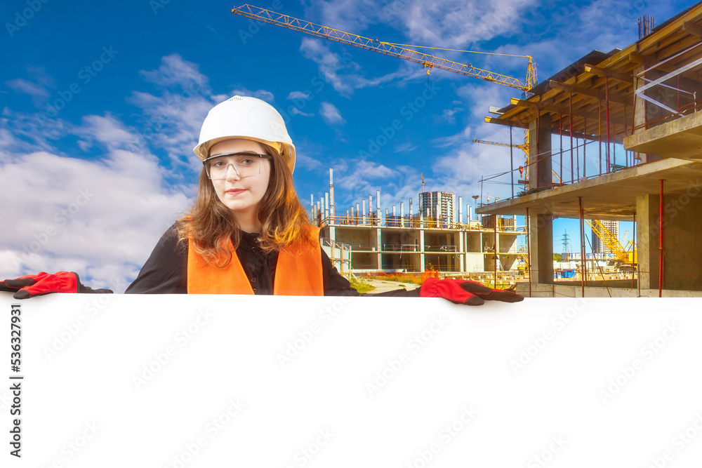 Builder with blank banner. Woman at construction site. Construction of ...