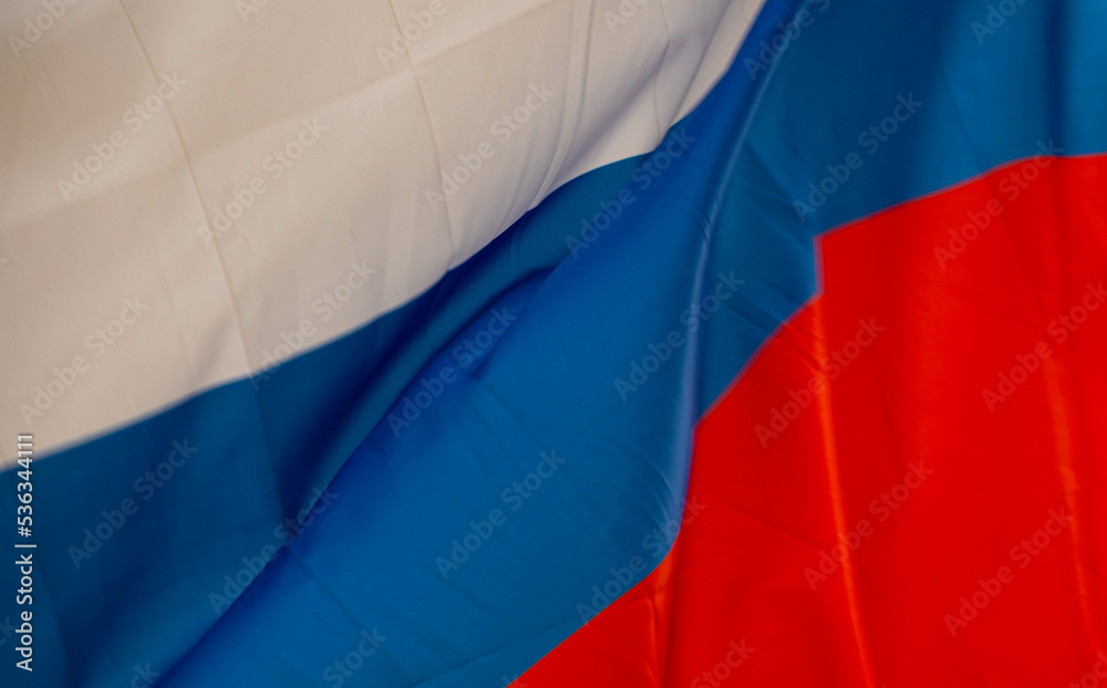 the Russian flag is flying in the wind. russian tricolor flag ...