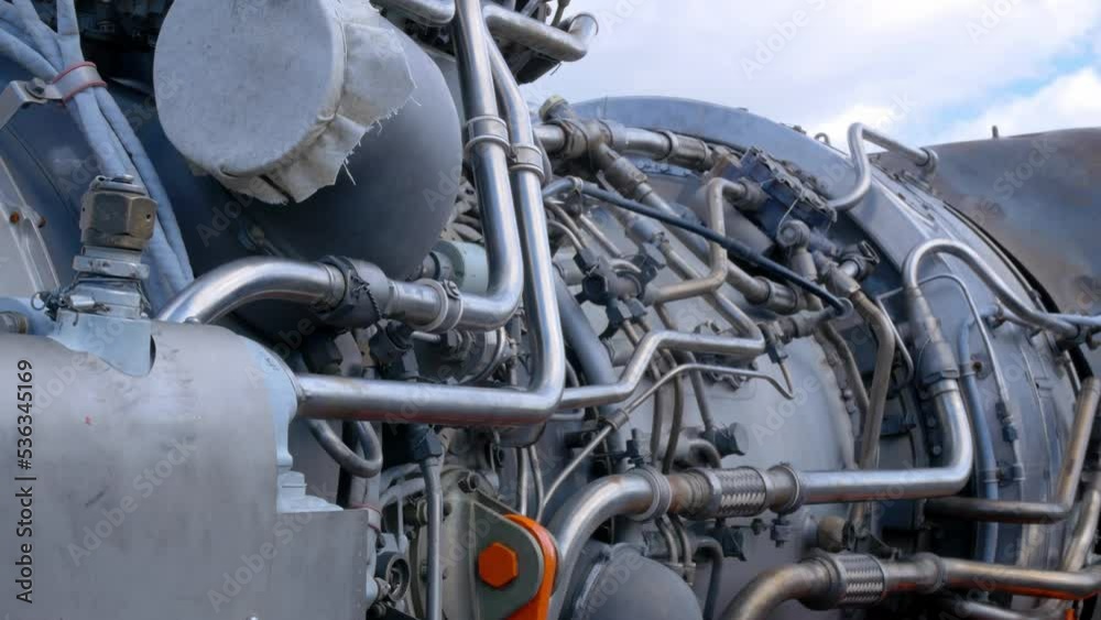 Mechanic engine expert shows the design of a helicopter engine, the ...