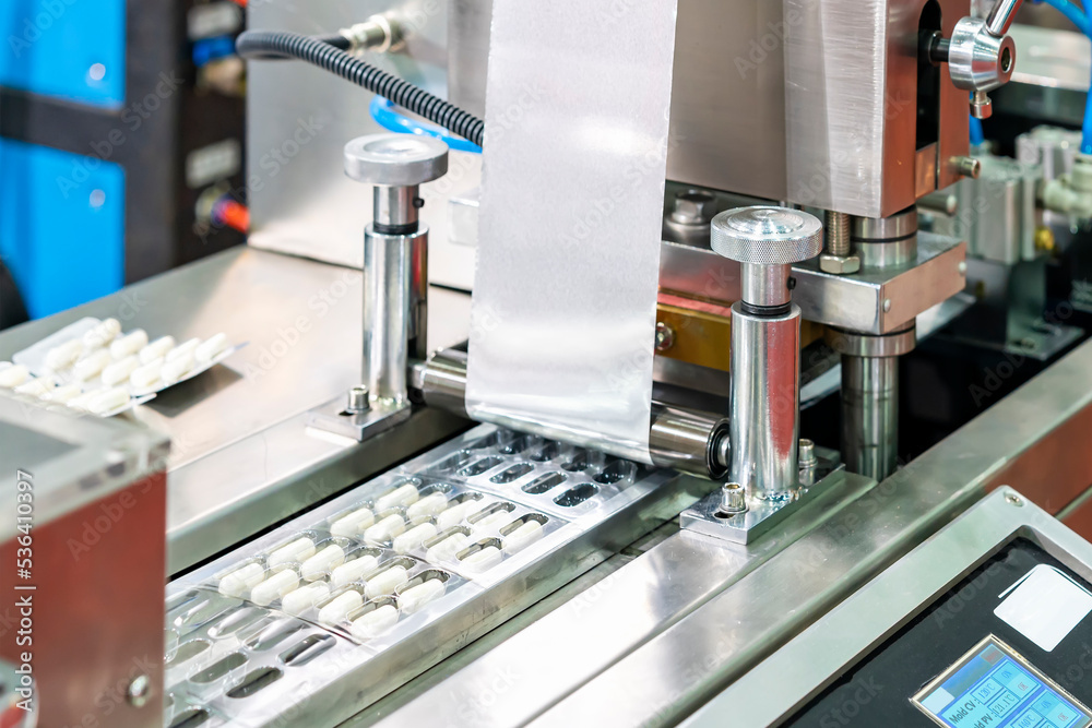Poster Print capsules wrapped in ptp sheet during manufacturing process by machine blister pa 40x26.7 cm
