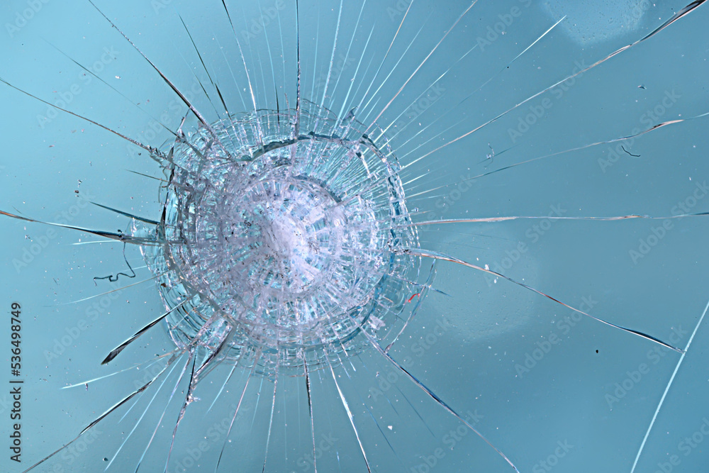 cracks on the glass impact on the glass, abstract background broken ...