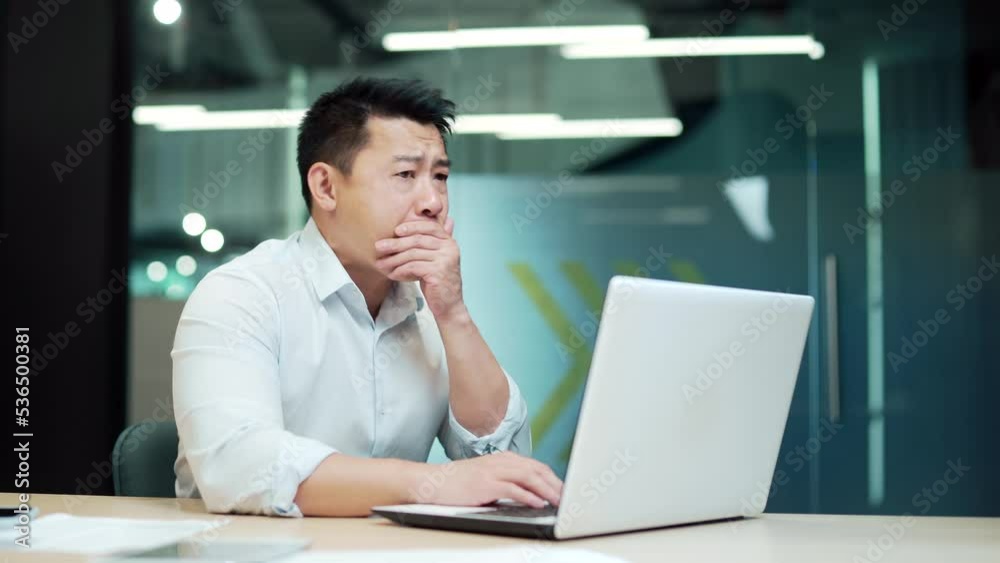 Business male feels bad, her stomach hurts, feeling nausea. Asian male ...