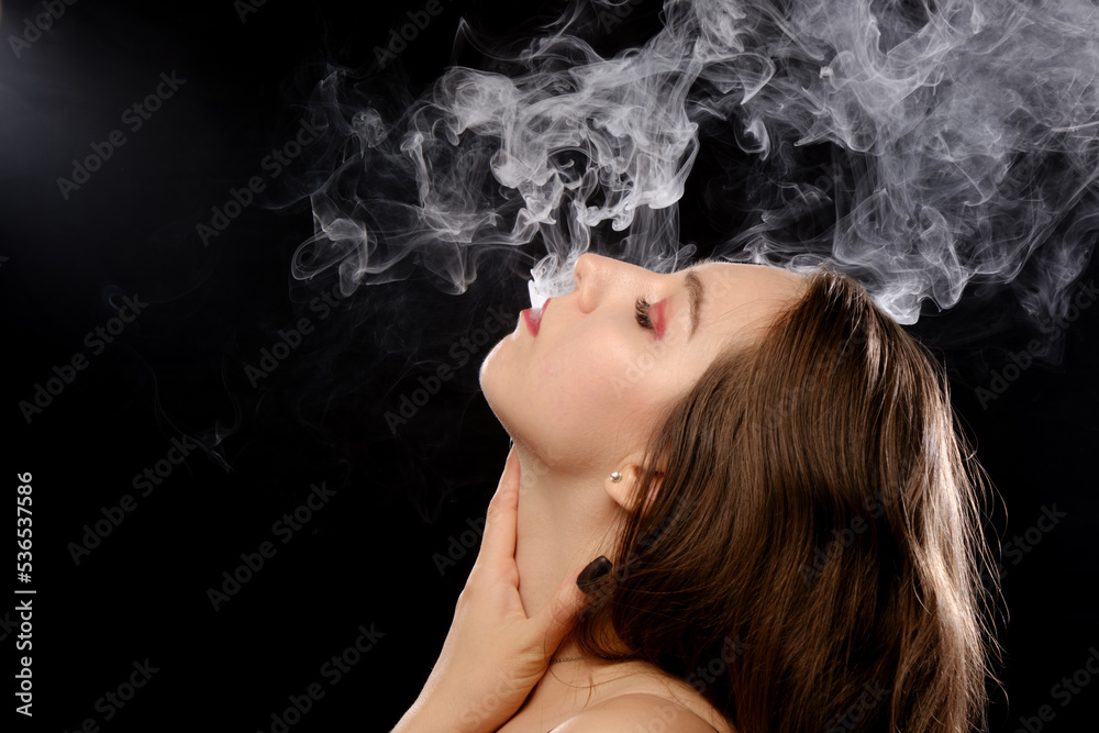 Woman Blowing Smoke