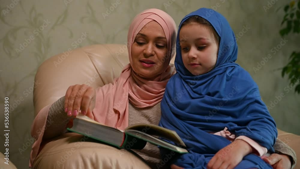 Muslim Middle-Eastern woman, a loving mother in pink hijab and ...