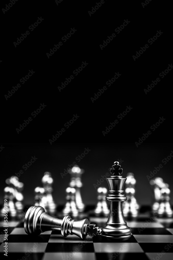 King chess pieces stand on falling chess in vertical concepts of ...