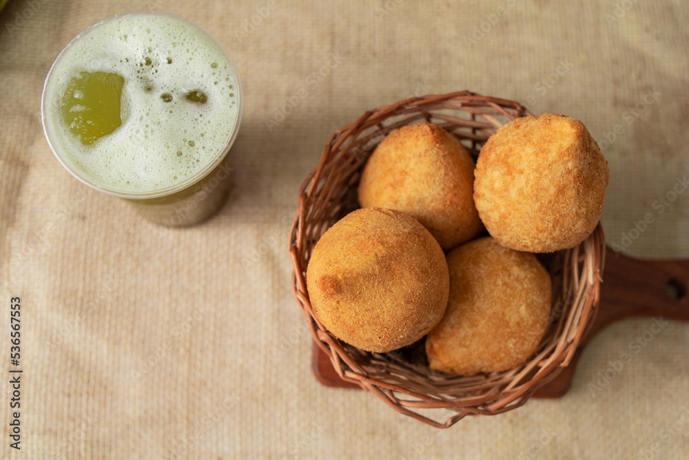 Traditional brazilian snack. Coxinha of chicken and cane juice. Stock ...