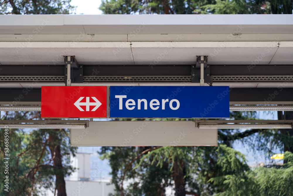 Sign with SBB logo of Swiss Railway Company at railway station Tenero ...
