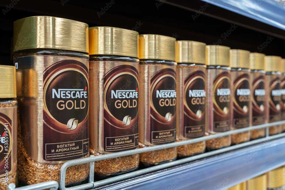 Foto de Nescafe Gold coffee on store shelf. Nescafe instant coffee ...