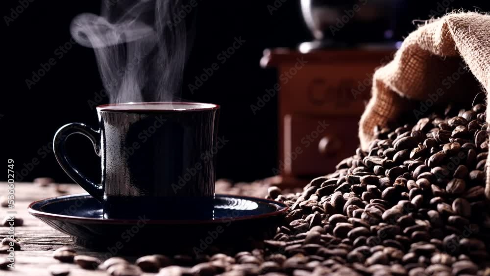 Hot Coffee Cup and Coffee Beans. Close-up beautiful natural steaming ...
