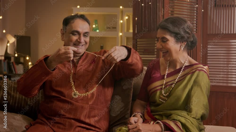 A happy Indian traditional Hindu elderly married couple where an old ...