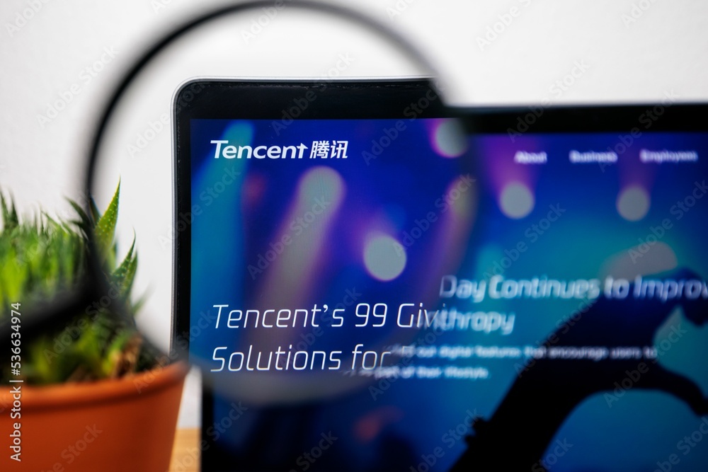 Logo of Tencent on a laptop desktop under a magnifying glass Stock ...