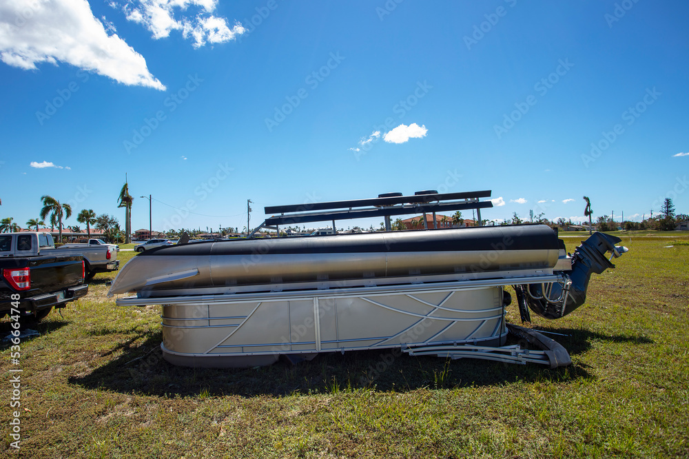 Upside down pontoon boat damaged during a storm surge in Cape Coral ...