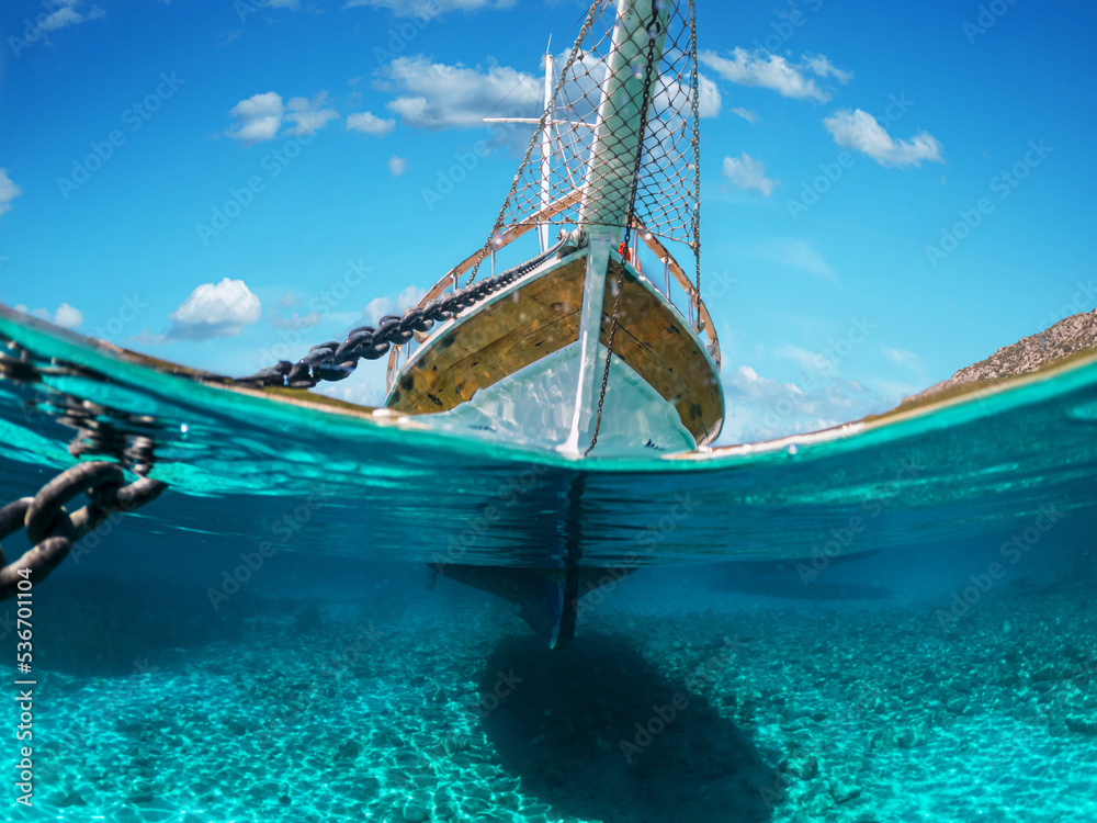 Split view - half underwater view of beautiful seabed with sea fishes ...