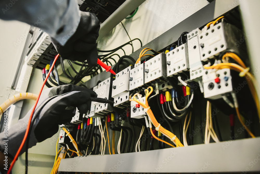 Electrical engineers test electrical installations and wiring on ...