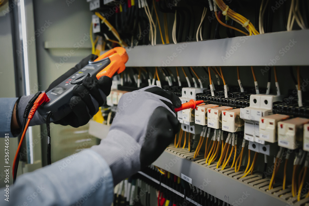 Electrical engineers test electrical installations and wiring on ...