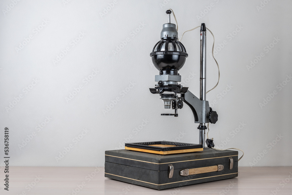 Antique photographic enlarger (1967) with a case as object table. Stock ...