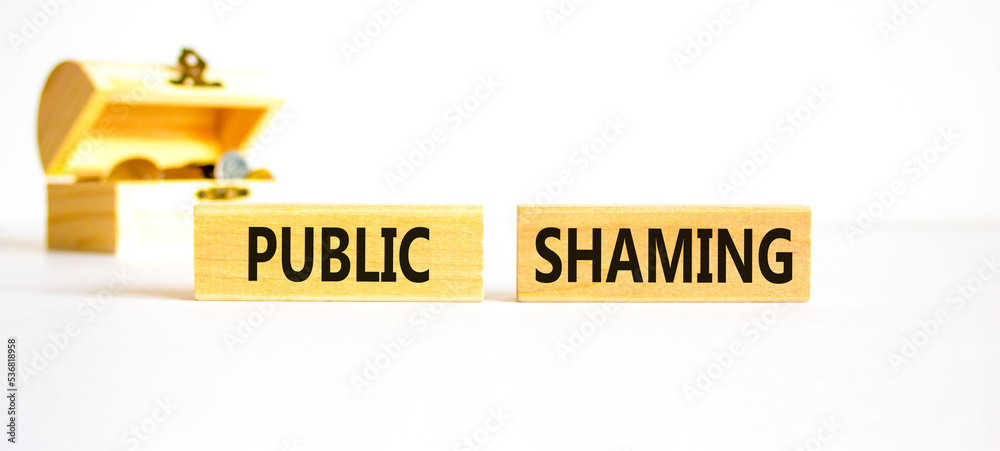 Public shaming symbol. Concept words Public shaming on wooden blocks on ...