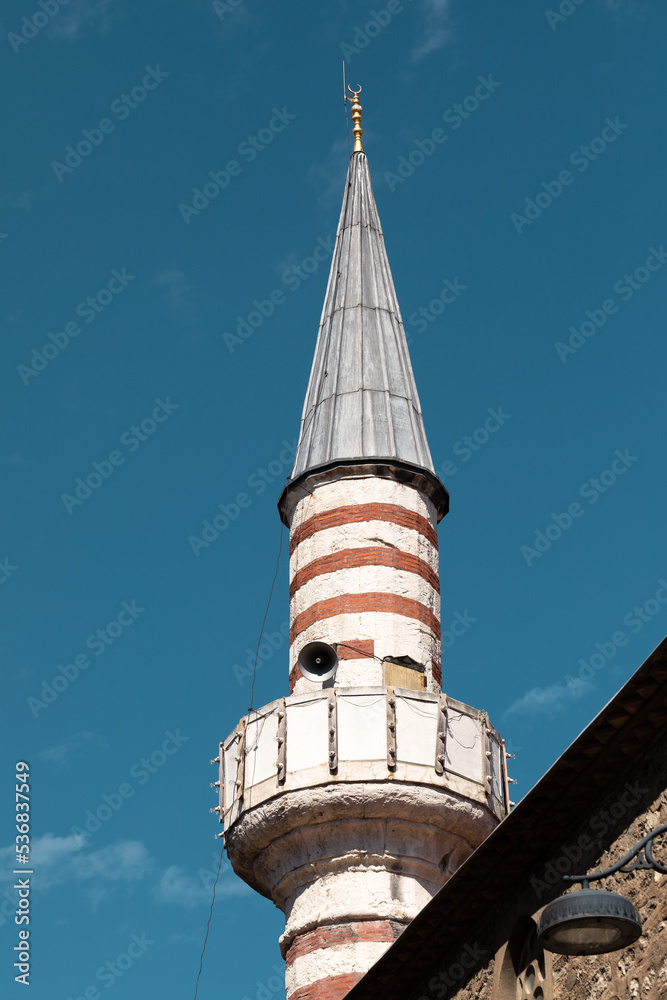 Red and white striped minaret of the mosque in Istanbul. Stock Photo ...