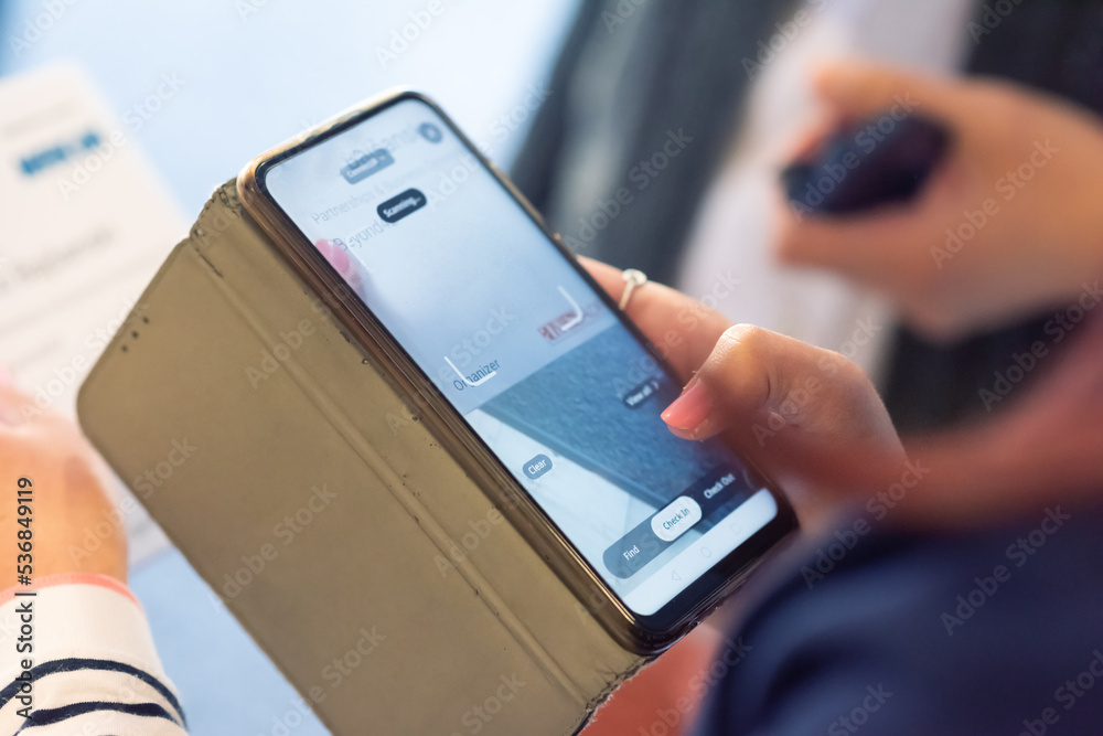 Conference Staff Member scan a QR code from attendee upon arrival to ...