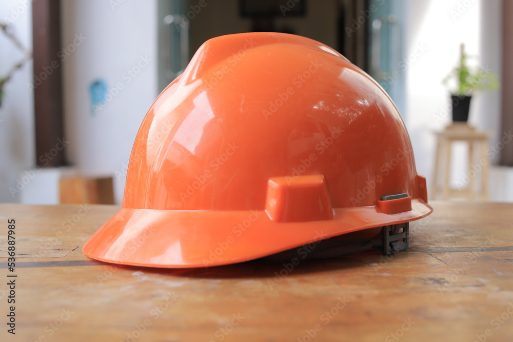 orange safety helmet hard hat, tool protect worker of danger in ...