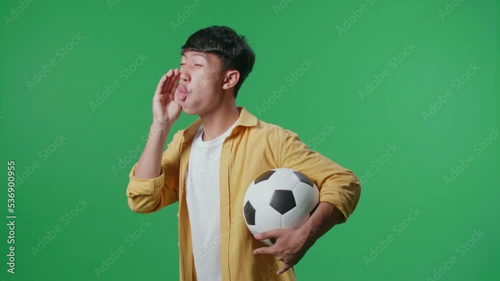Side View Of Asian Boy With A Ball Making Fun Of The Losers By Ooh Face ...