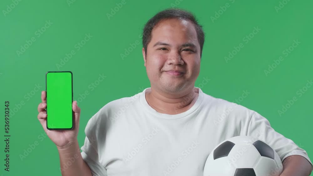 Close Up Of Asian Man With A Ball Showing Mock Up Green Screen ...