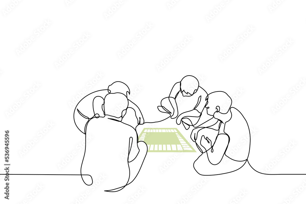 group of young people sit on the floor in front of a card and play a ...