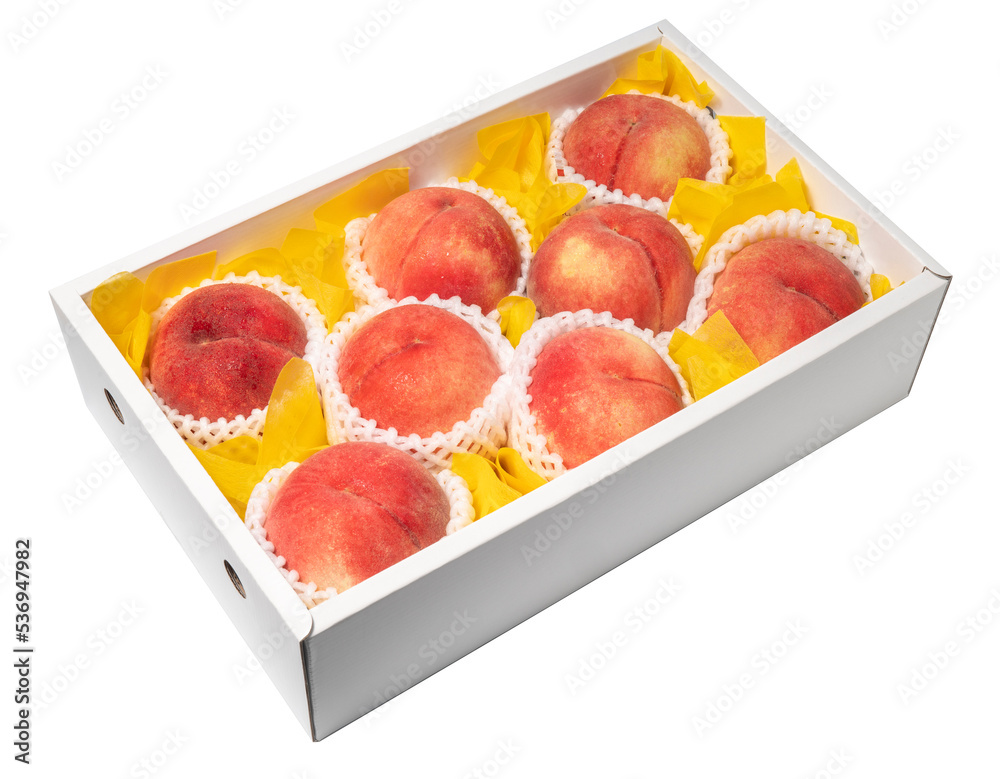 Peach fruit in packaging ready to export isolated on white background ...