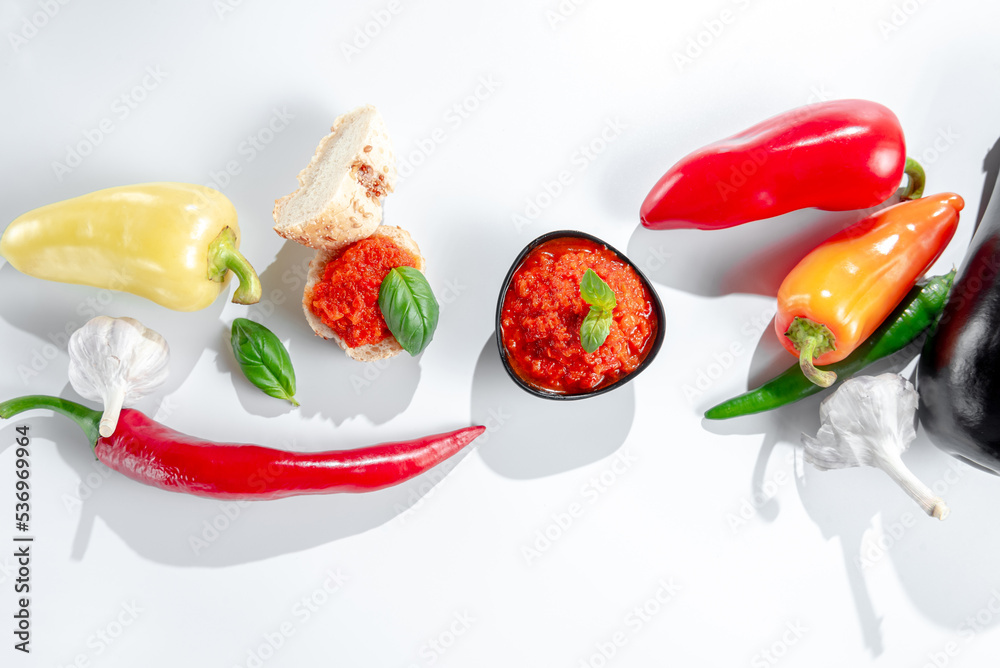 Vegetable paste, chopped vegetable caviar on a white background. Ajika ...