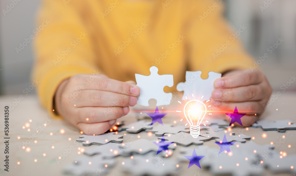 child development concept, the image of kids hands holding puzzles to ...