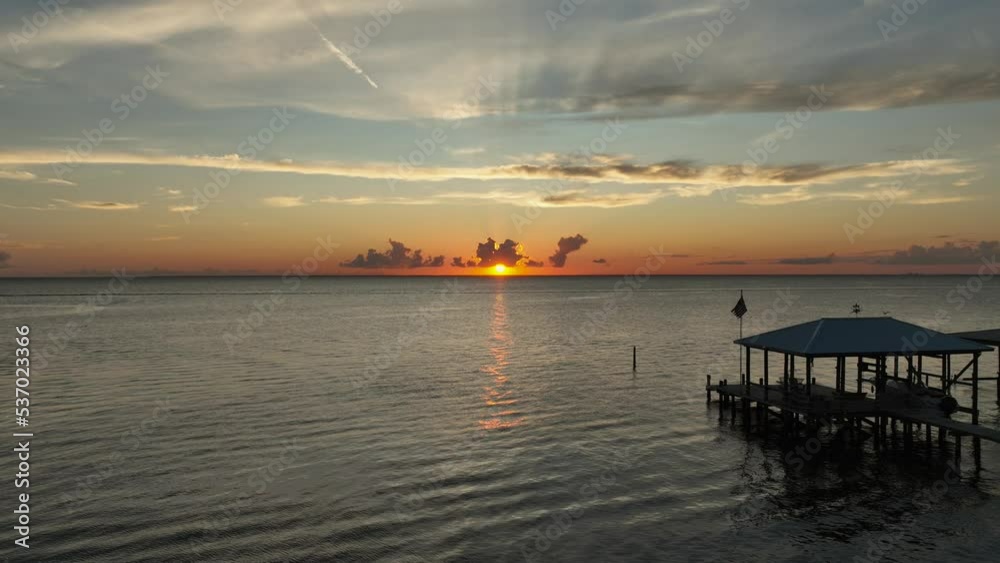 Sunsetting over Mobile Bay while Boaters play in the bay. Stock Video ...