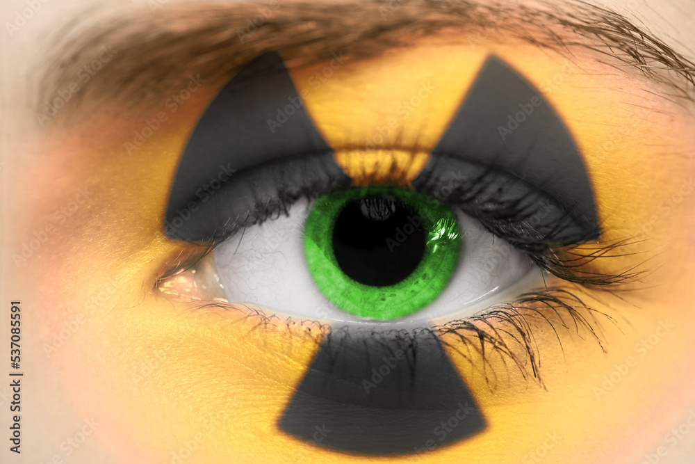 female eye with radioactive sign Stock Photo | Adobe Stock