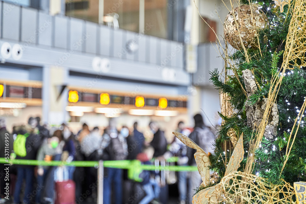 Flying in Christmas concept. Detail of big Christmas tree with golden ...