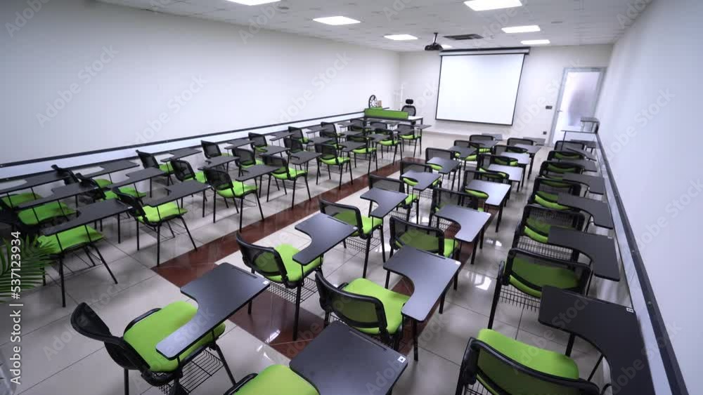 Minimalist interior of a presentation room with green chairs and blank ...