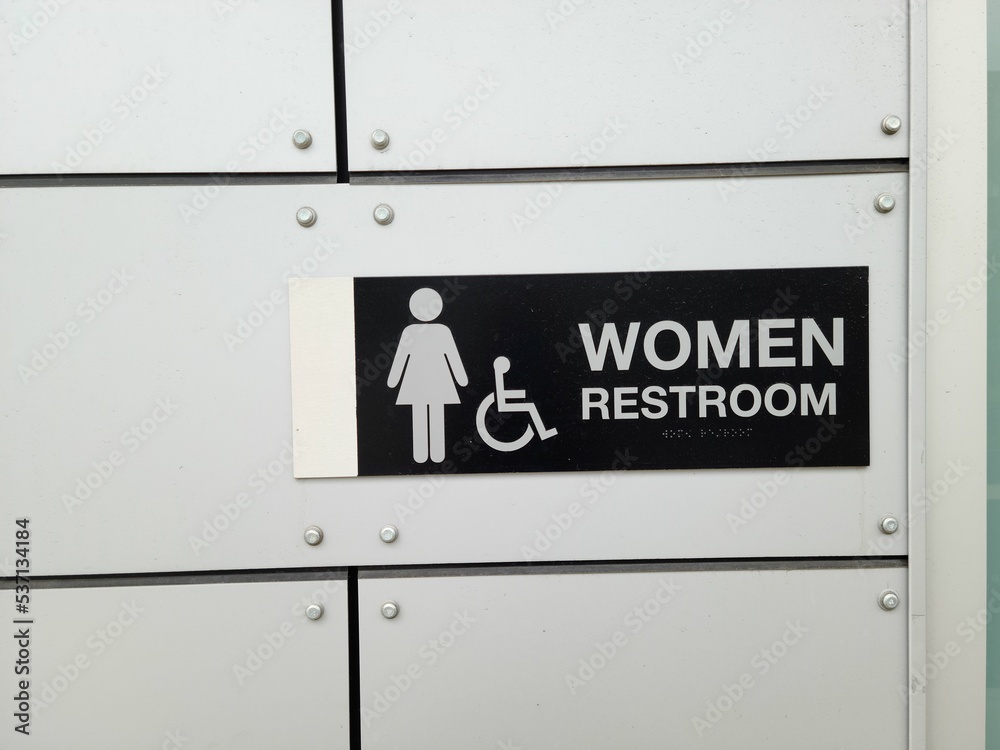 Women toilet sign on white wall front view Stock Photo | Adobe Stock