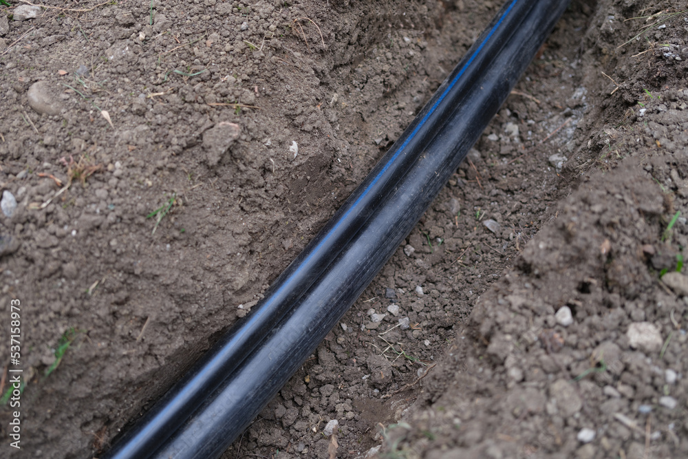 Frame for connecting pipes in trench of ground Stock Photo | Adobe Stock