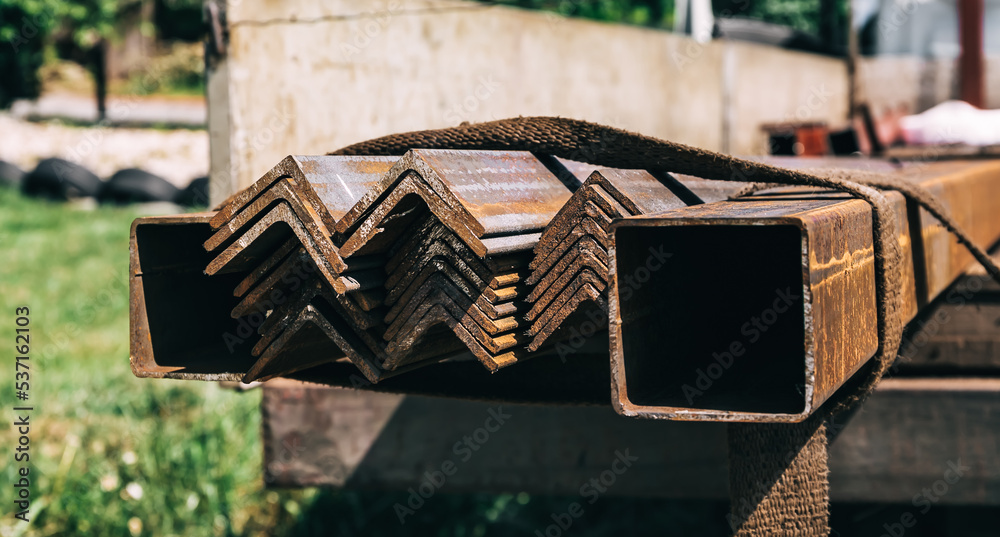 Steel profile tubes, corners and rods for the concrete reinforcing lies ...