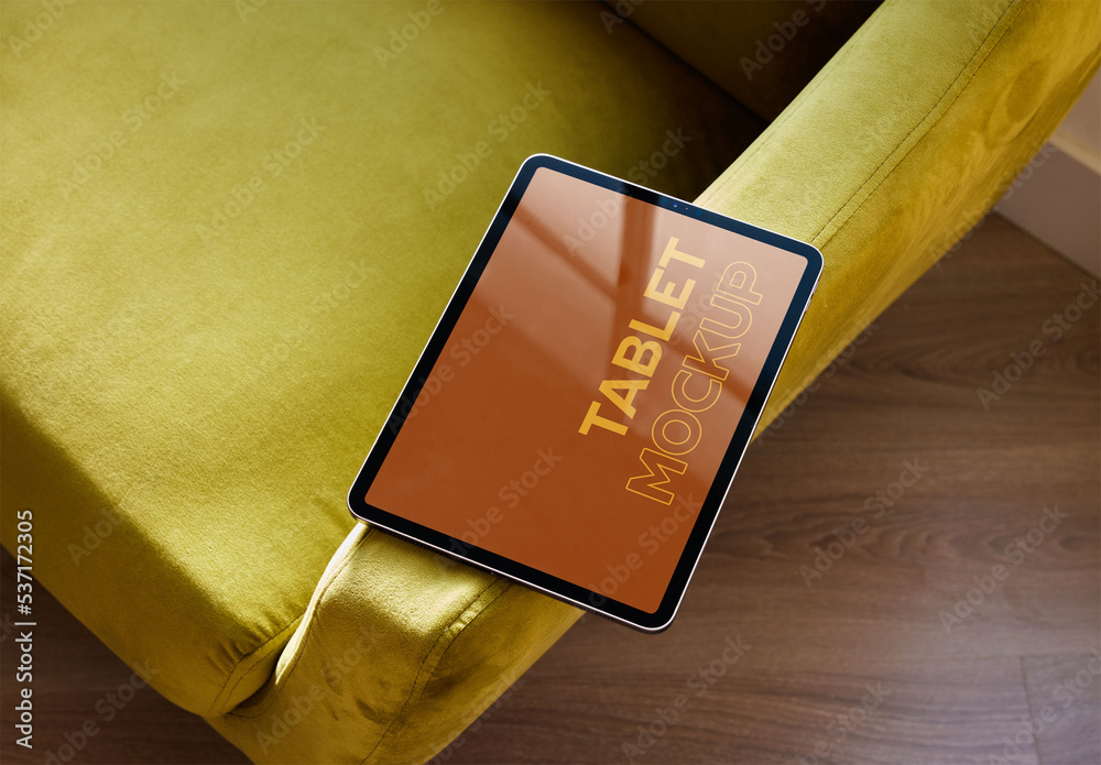 Vertical Tablet Mockup on a Green Sofa Arm Rest Stock Template | Adobe ...