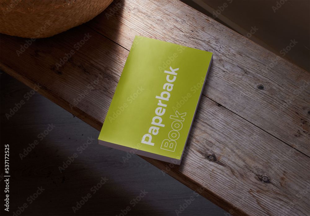 Paperback Book Mockup on Wooden Table With Natural Light and Shadows ...