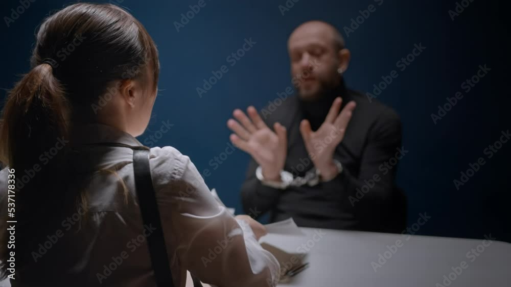 Male suspect refuses to look at and read documents that female Police ...