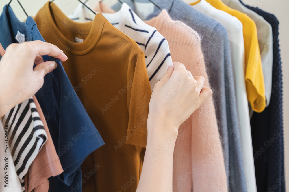 Choice of clothes, Nothing to wear asian young woman, girl hand in ...