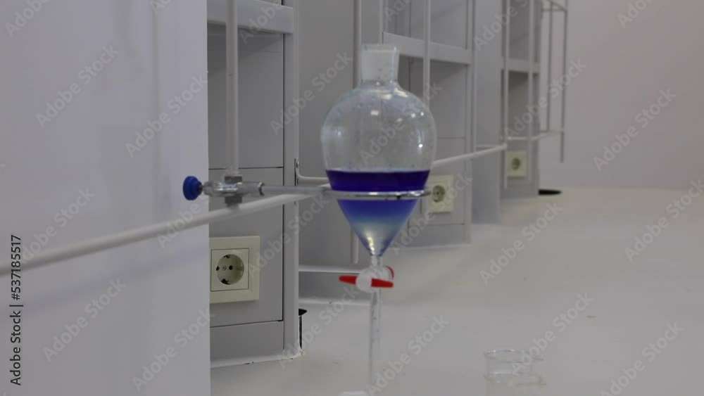 Separating funnel laboratory glassware used in liquid-liquid ...